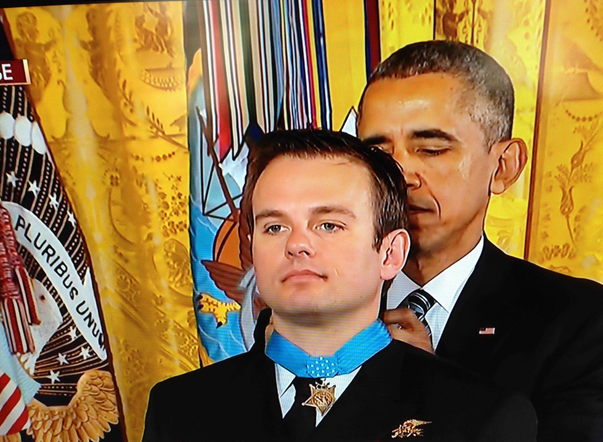 Navy SEAL comes out of the shadows just long enough to accept the Medal ...