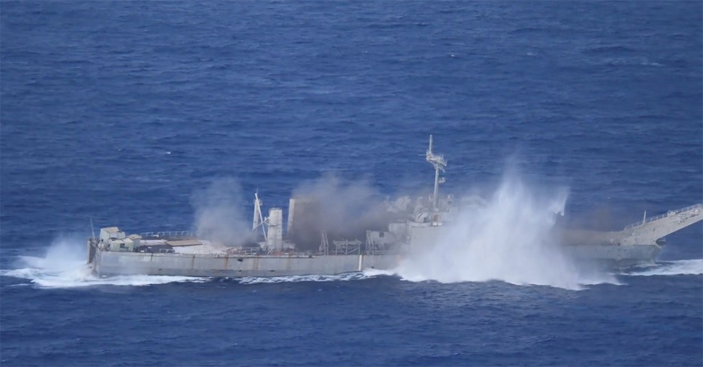 See a decommissioned ship get beat down by Army, Navy